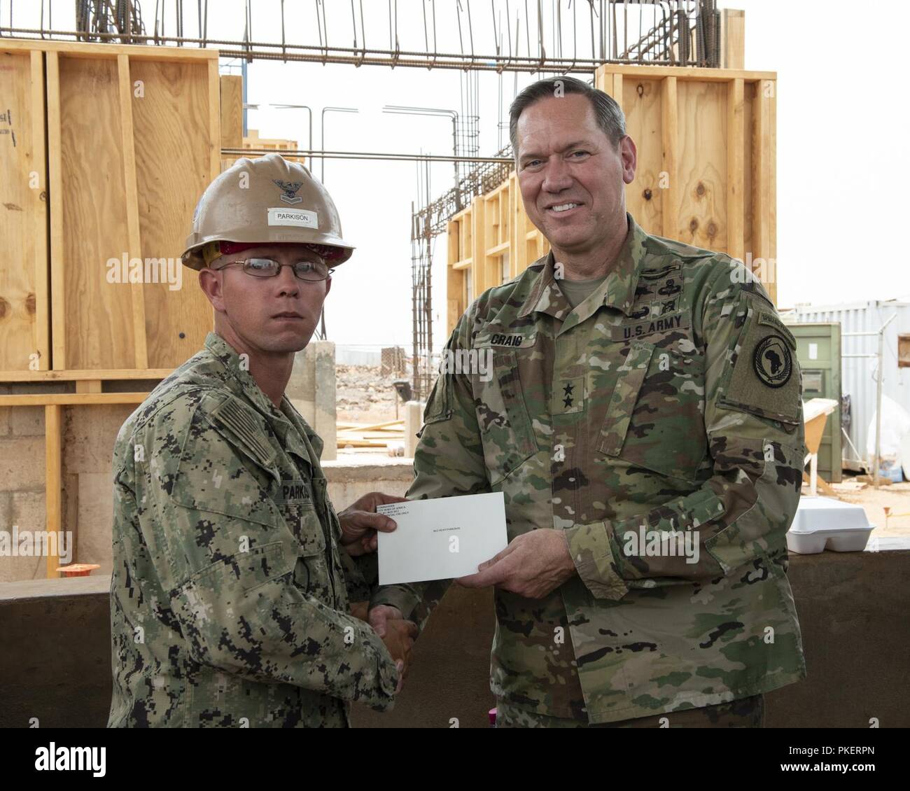 U.S. Navy Builder Petty Officer 2nd Class Sean Parkinson, project crew ...