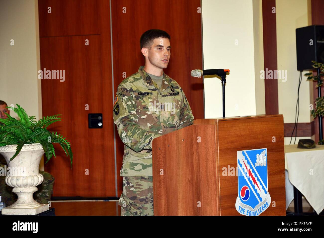 U.S. Army Capt. Jesse R. Cooper, incoming commander, gives a speech ...