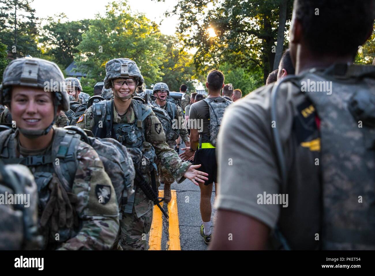 A Class of 2022 U.S. Military Academy cadet smiles as she marches to ...