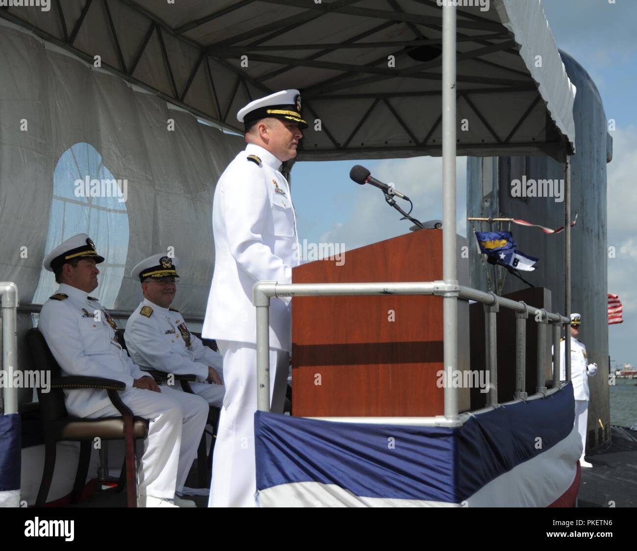 NORFOLK, Va. (Aug. 1, 2018) Capt. Martin Muckian, Commander Submarine Squadron Six, addresses ...