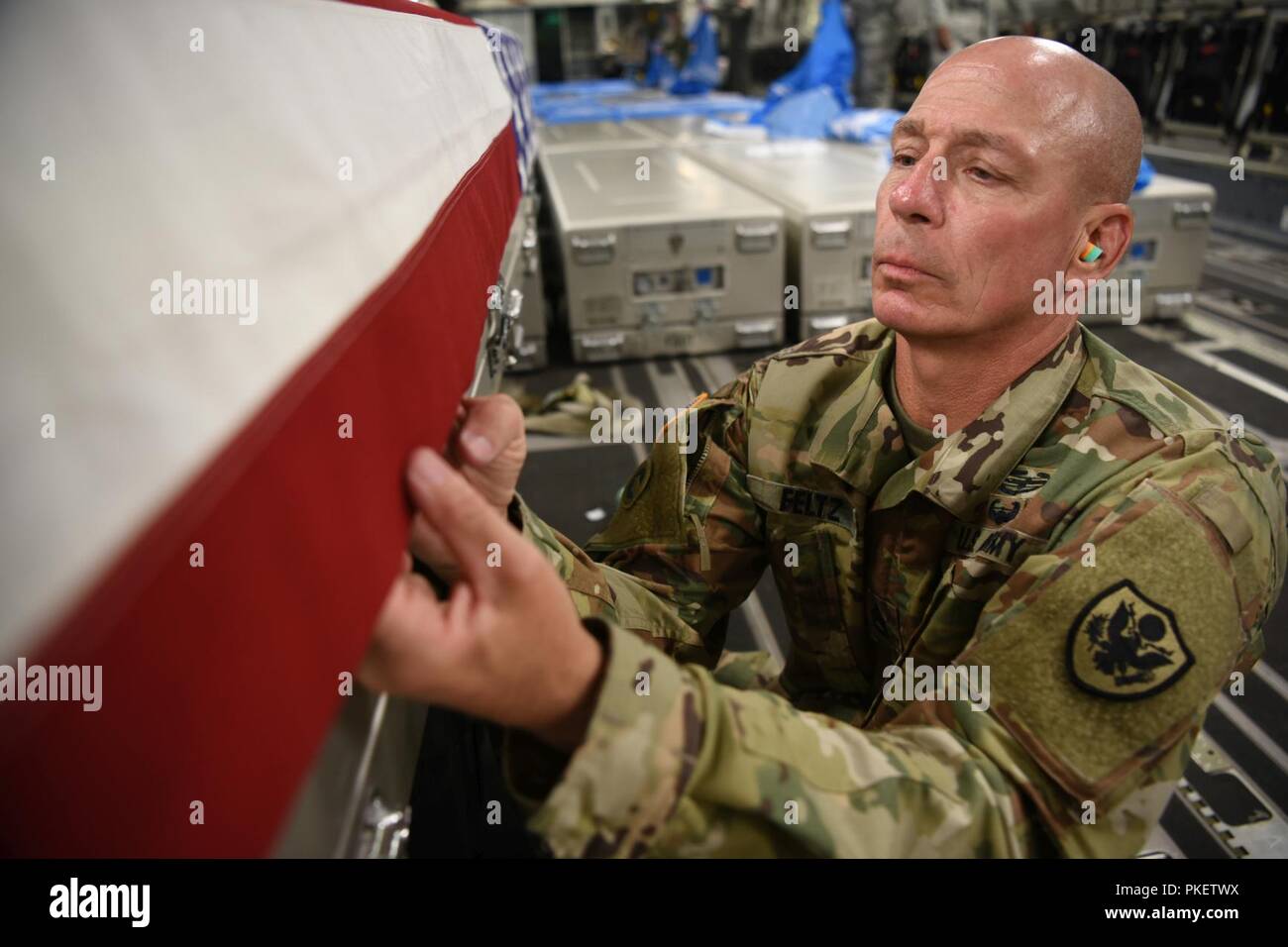 U.S. Army Sgt. 1st Class Eric Feltz, mortuary affairs specialist ...