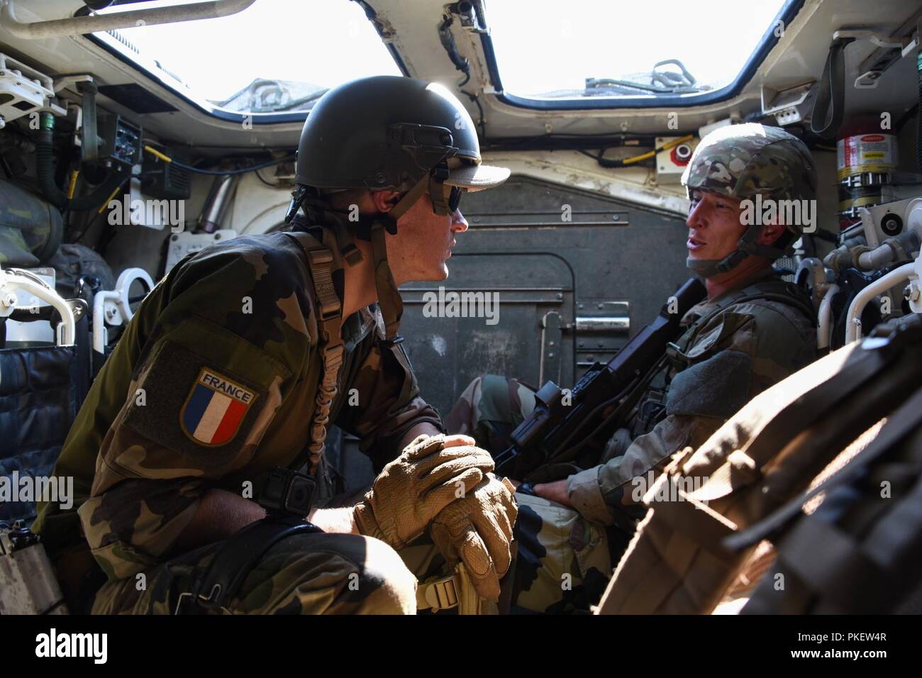 French soldiers ride in a Stryker vehicle after finishing the field ...