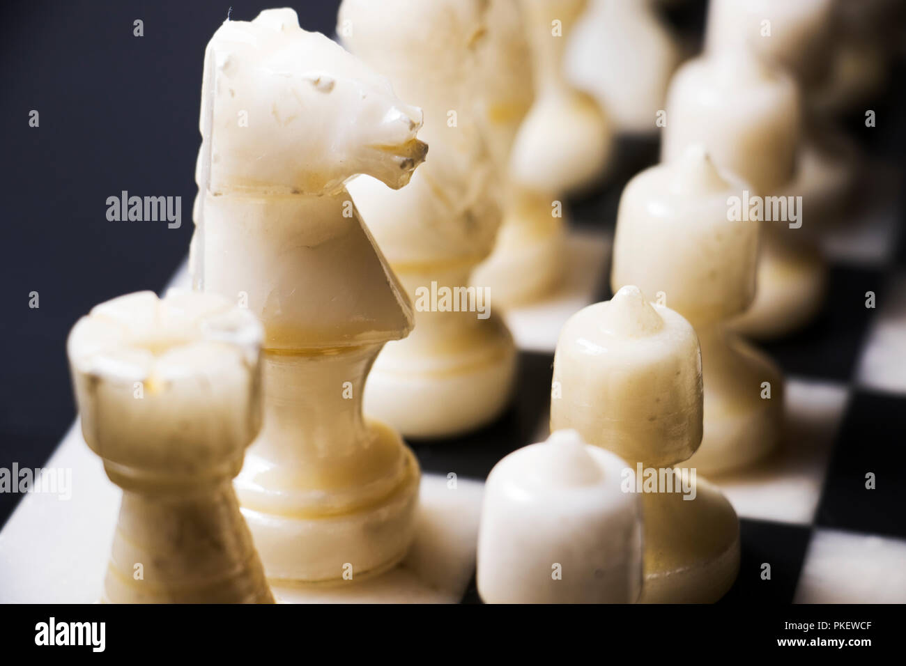 White chess pieces close up on a chess board Stock Photo - Alamy