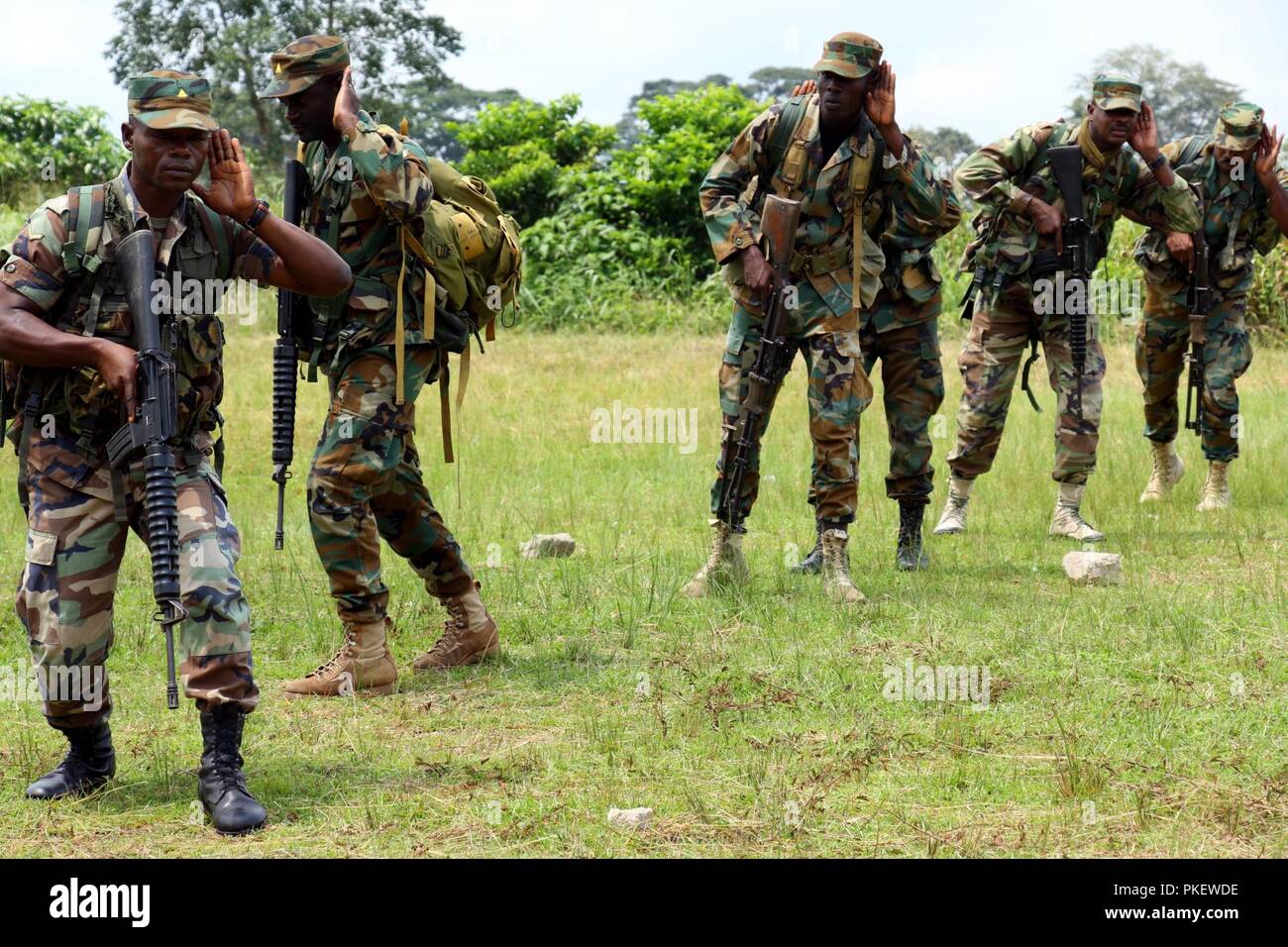 Instructors with the Ghana Armed Forces demonstrate jungle movements ...
