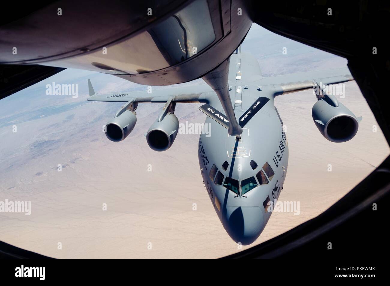 A 452nd Air Mobility Wing C-17 Globemaster III receives fuel from a ...
