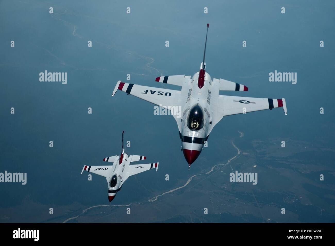 Two F-16 Flying Falcon Thunderbirds form up July 30, 2018, in the mid ...