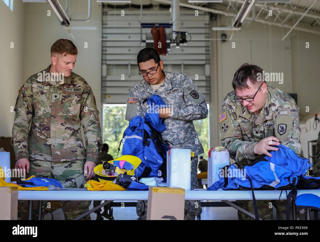 Spec. Derek Price, Pfc. Joshua Taulaga and Spec. Austin Miller with the ...