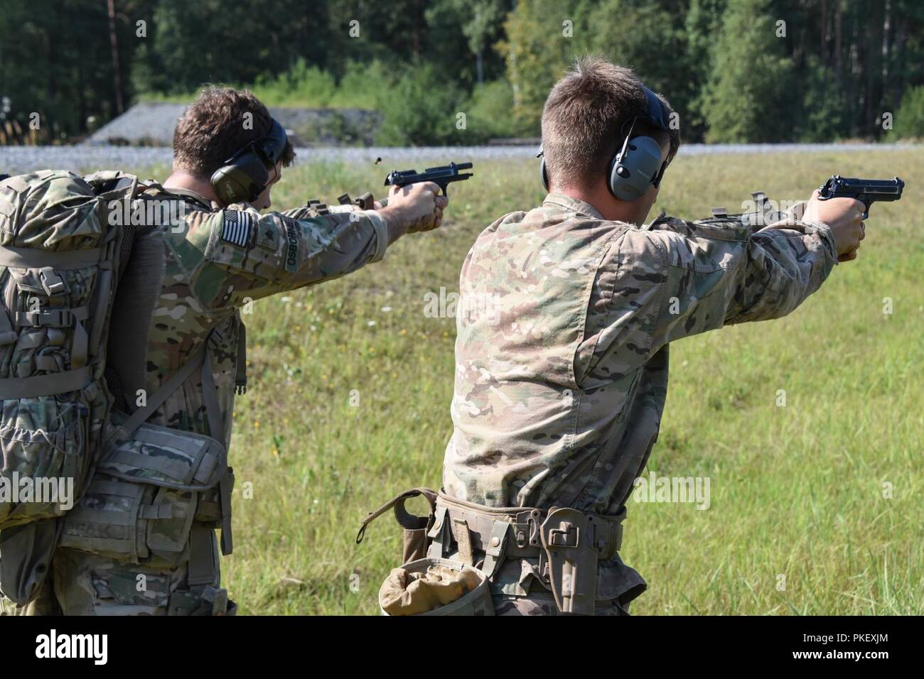 U.S. Soldier with 173rd Airborne Brigade fire their M9 pistols at the ...