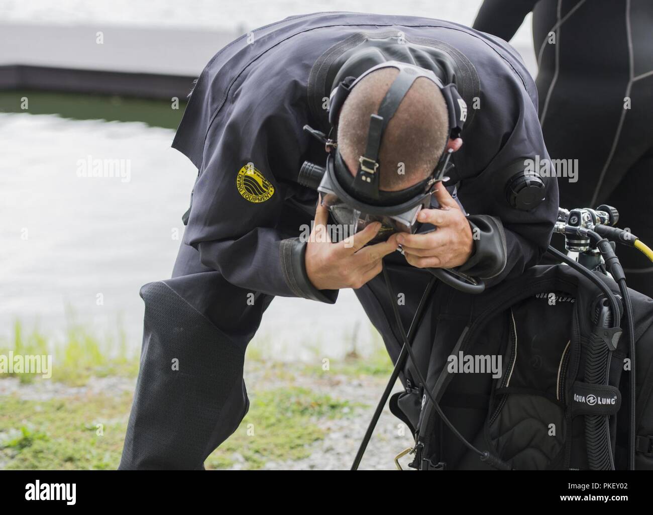 A diver with the 788th Civil Engineer Fire Department performs a ...