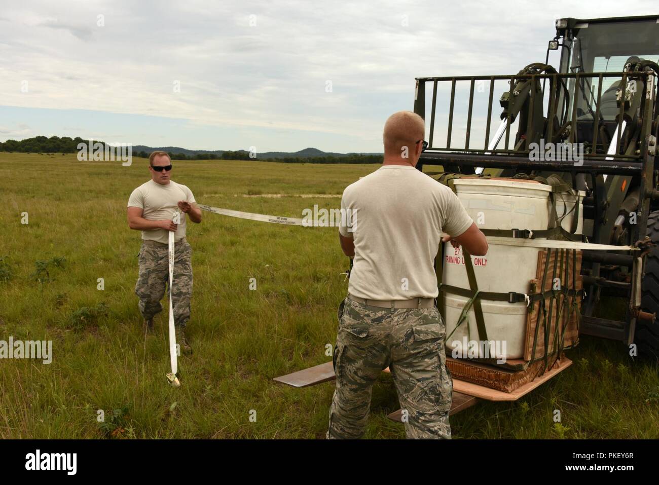 A 934th Airlift Wing C-130 released airdrop pallets during training at ...