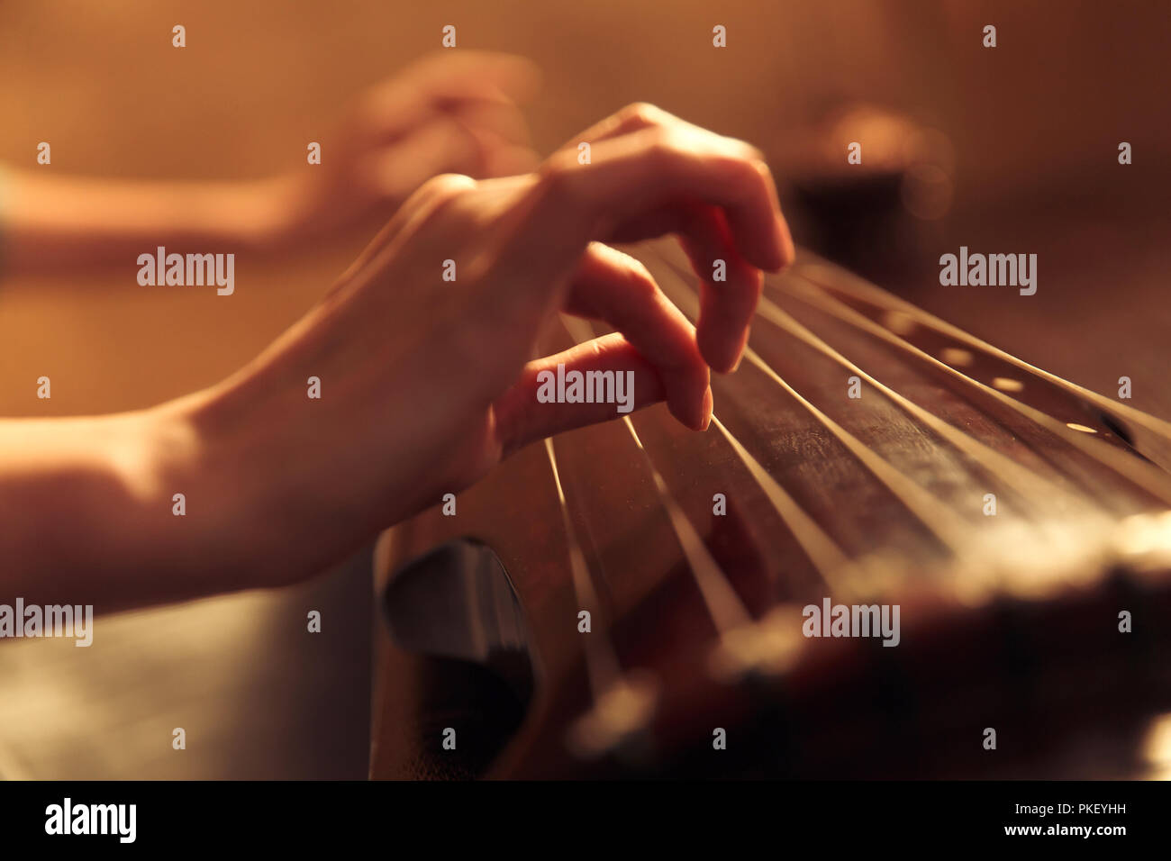 Young woman playing the lyre Stock Photo - Alamy