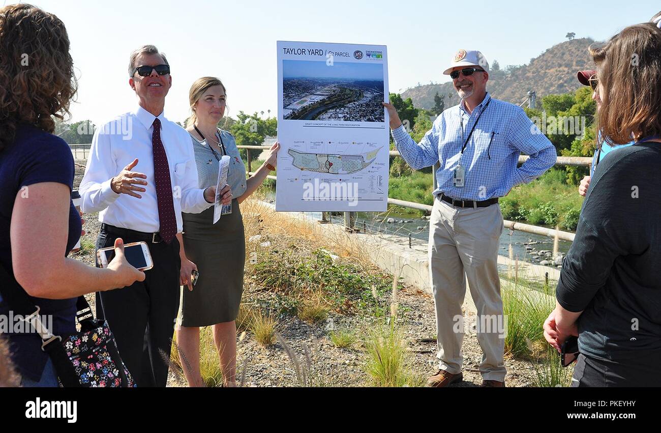 Gary Lee Moore, Los Angeles city engineer, second from left, talks to ...