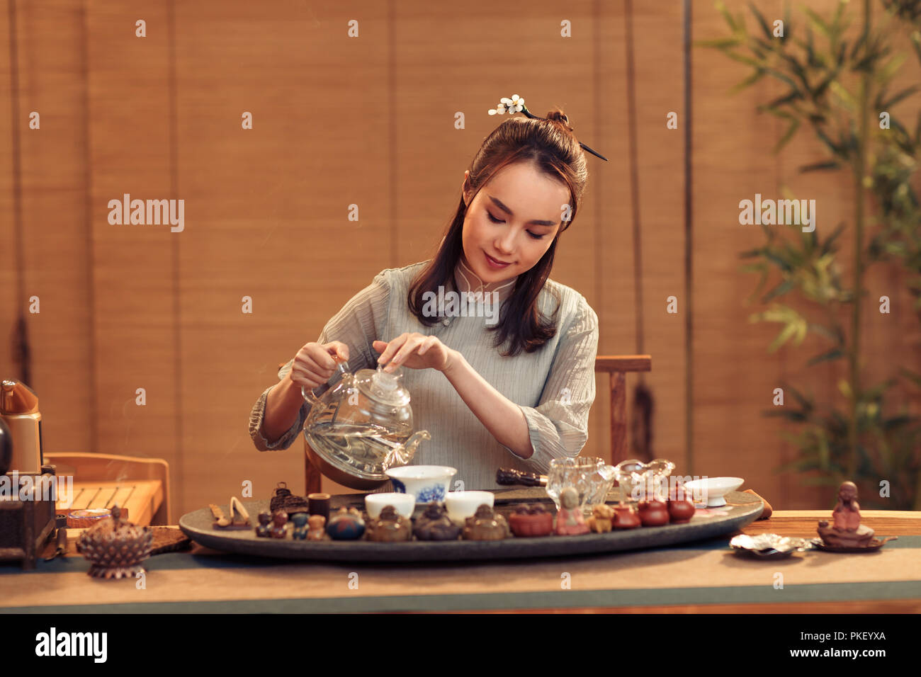 Young women show tea art Stock Photo - Alamy