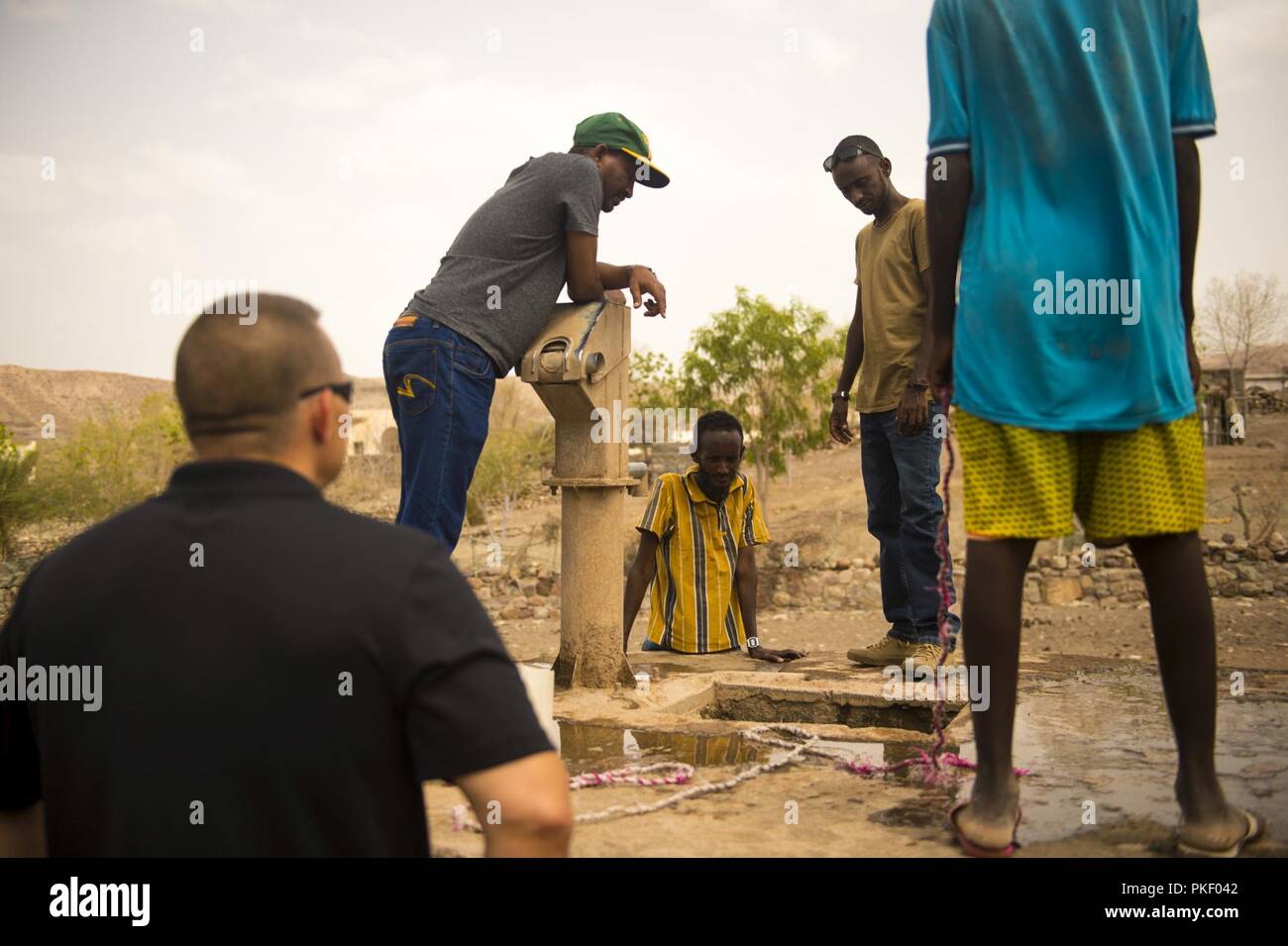 U.S. Army Civil Affairs members examine a well in the village Ribta in ...