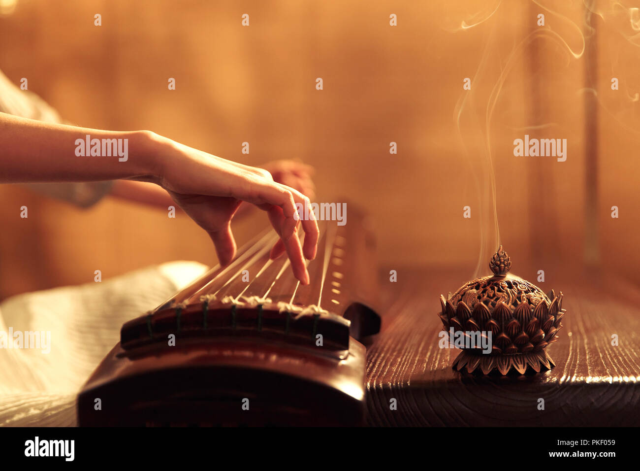 Young woman playing the lyre Stock Photo - Alamy