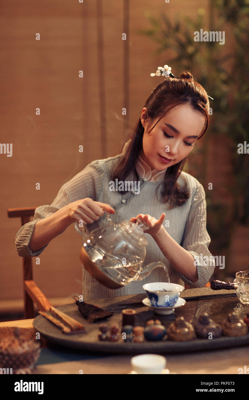 Young women show tea art Stock Photo - Alamy