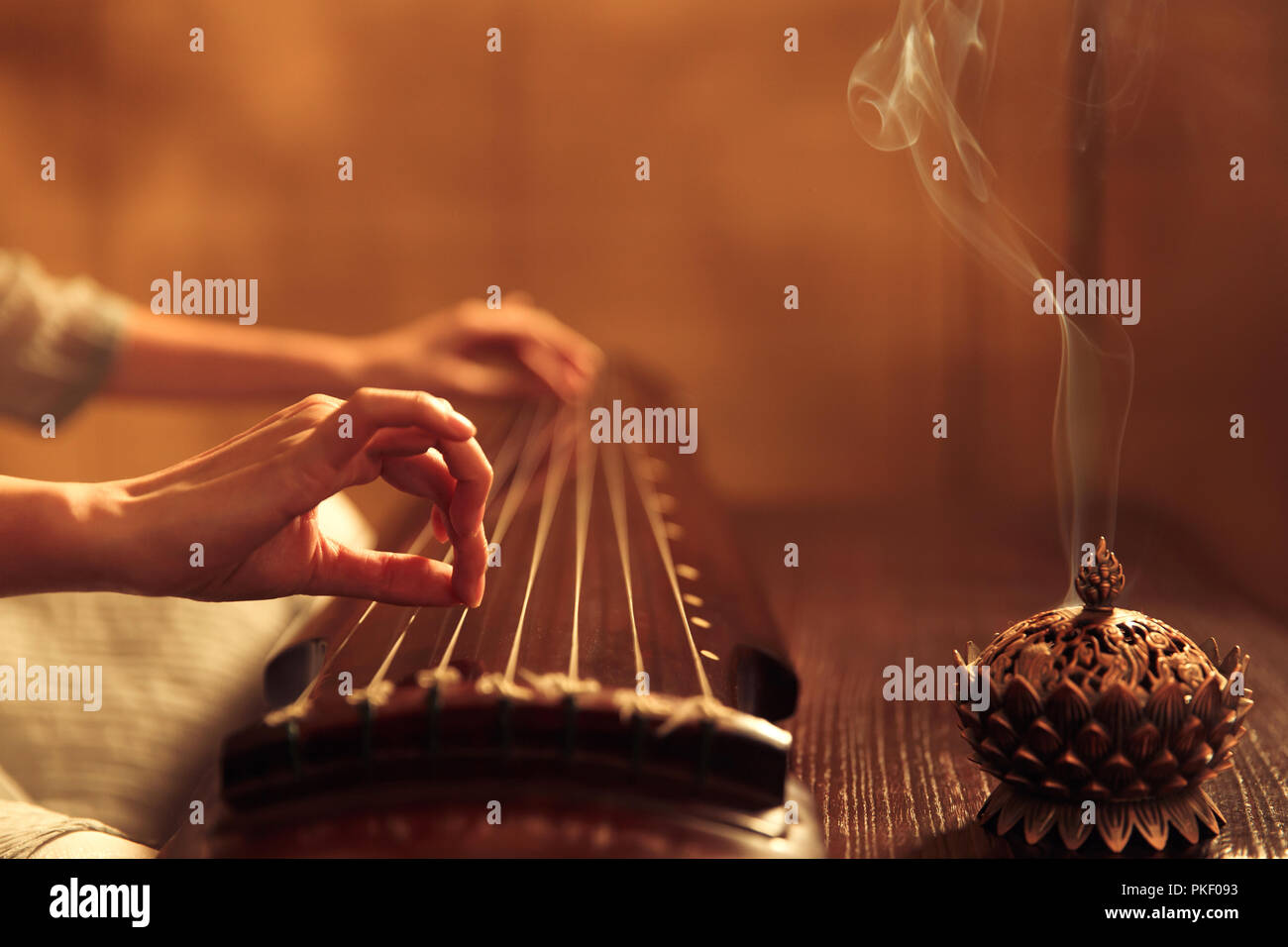 Young woman playing the lyre Stock Photo - Alamy