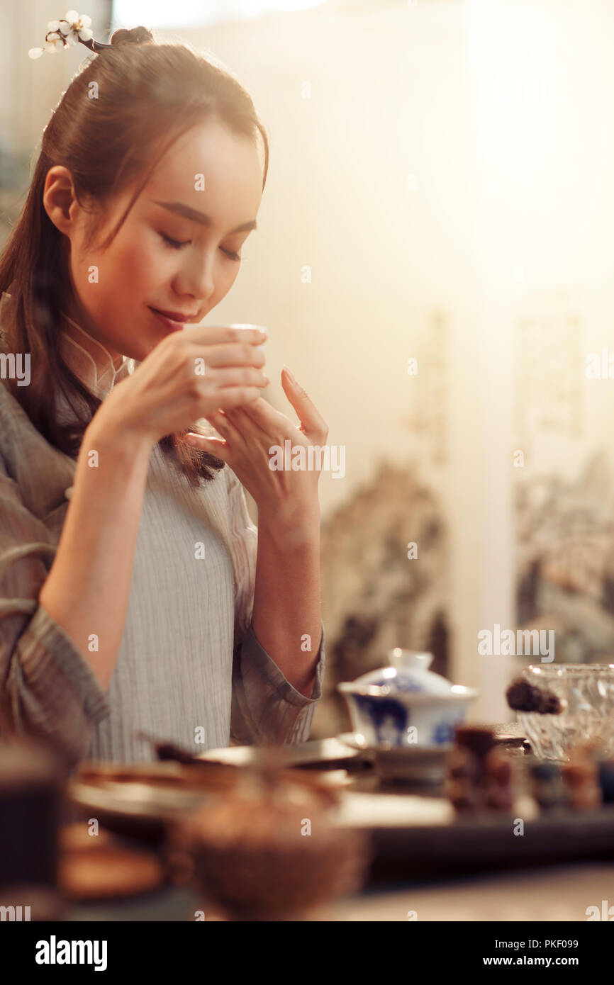 Young women show tea art Stock Photo - Alamy
