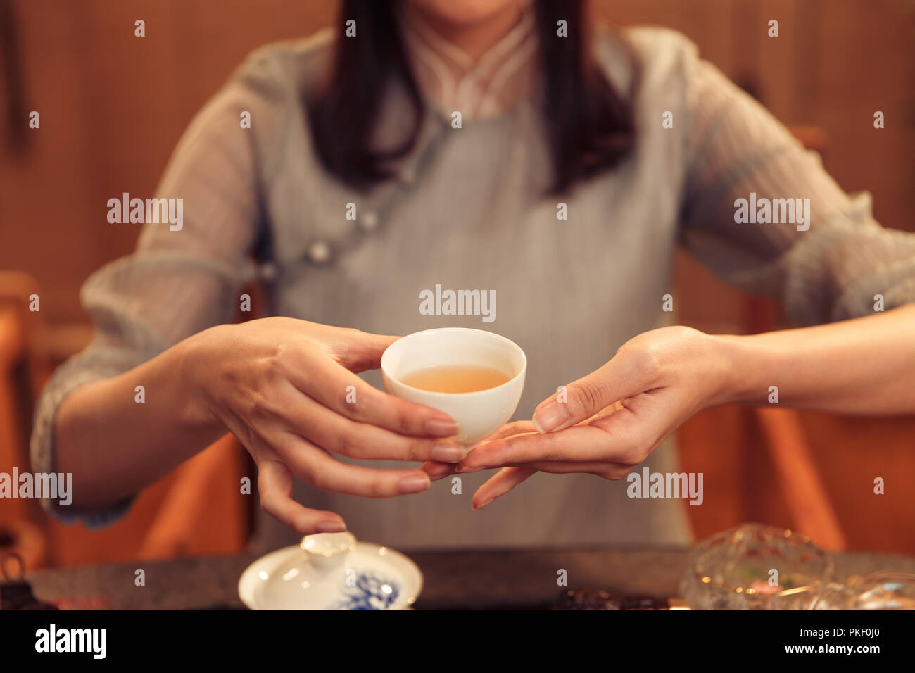 Young women show tea art Stock Photo - Alamy