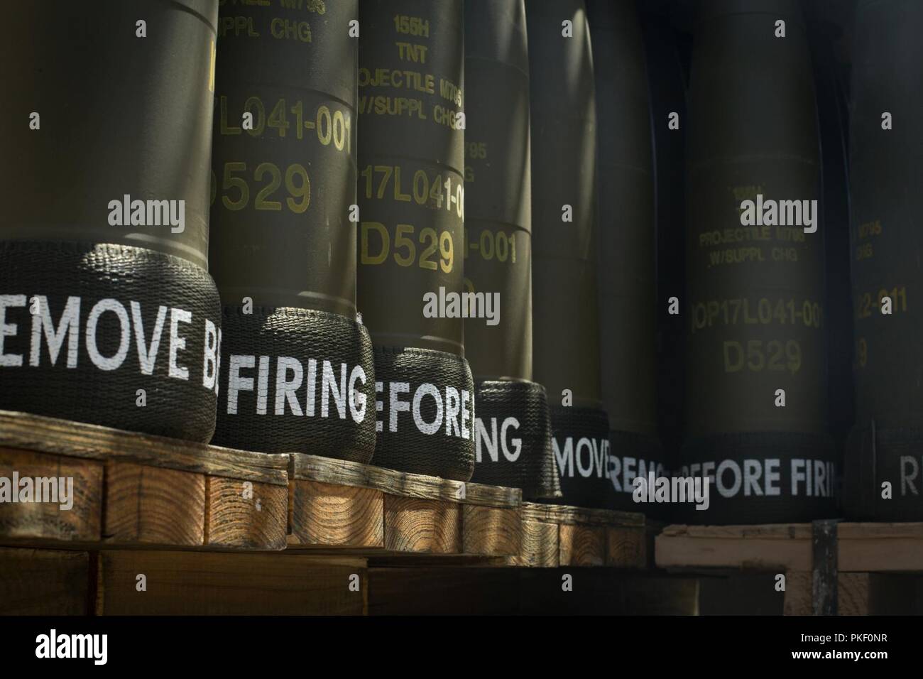 M777 towed 155mm howitzer rounds are stacked on Pallets during exercise ...