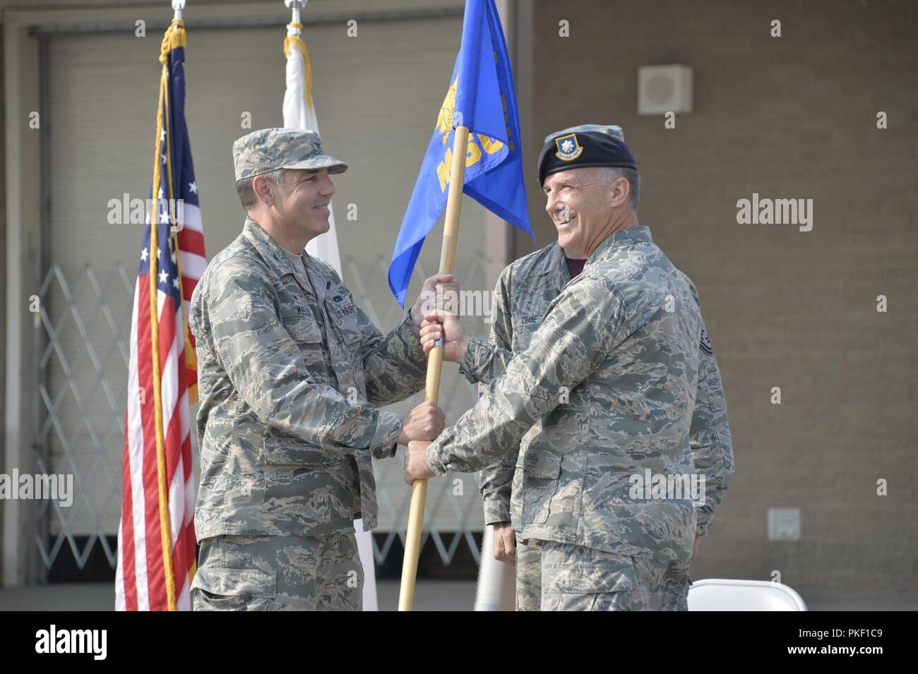 Col. Daniel Kelly, 144th Fighter Wing commander, gives the guidon to ...