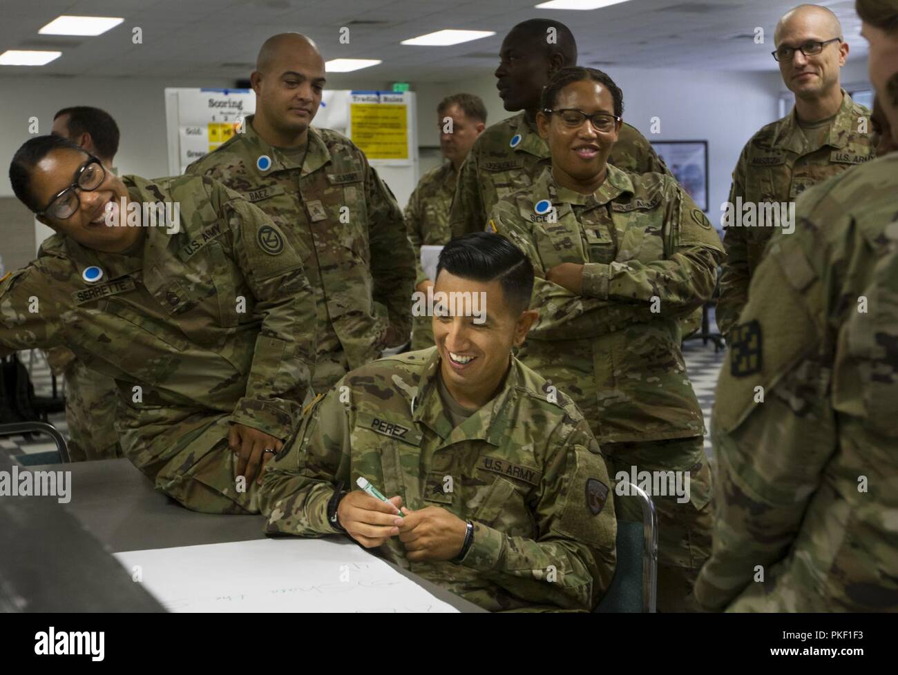 Sgt. Oscar Perez, of the 211th Inland Cargo Transportation Company, and ...