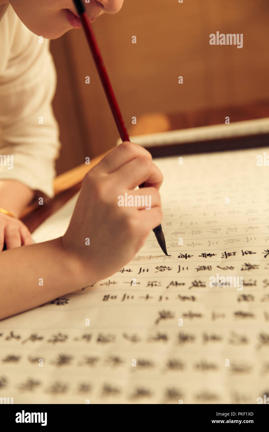 Young women in practice calligraphy Stock Photo - Alamy