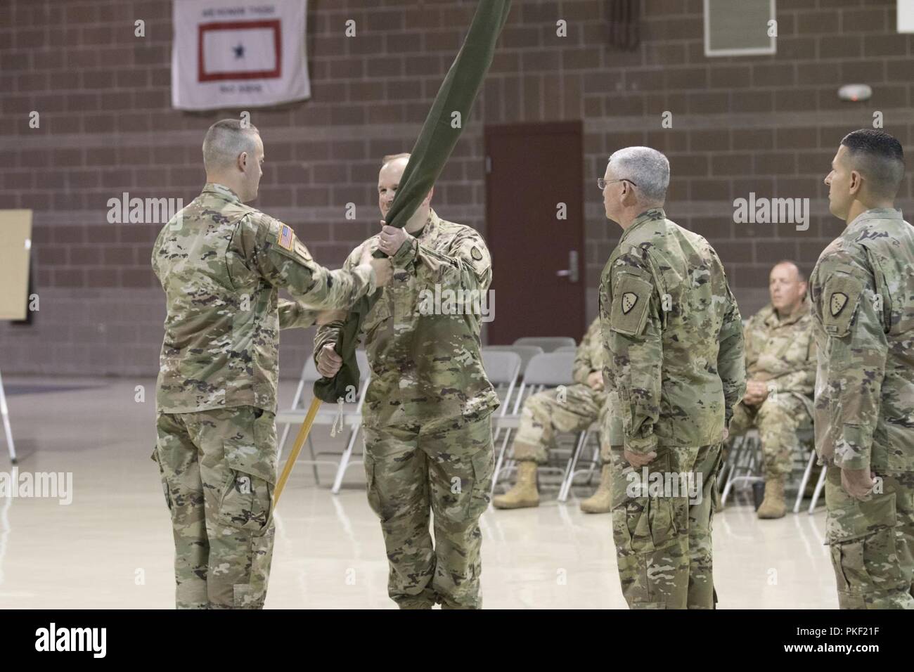 Col. Peter Mondelli, 297th Regional Support Group commander, receives ...