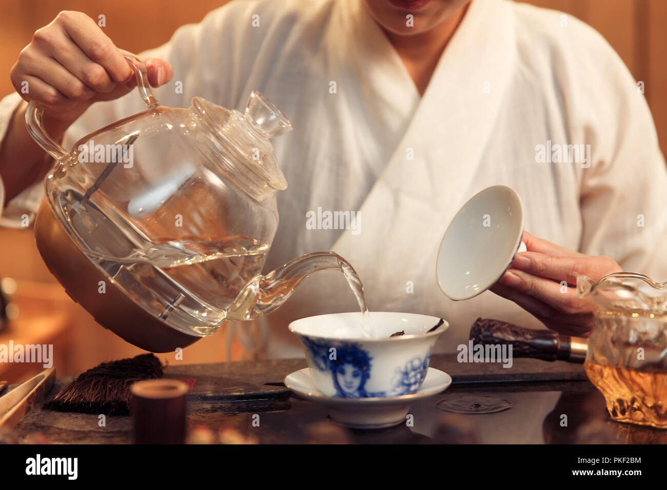 Young women make tea Stock Photo - Alamy