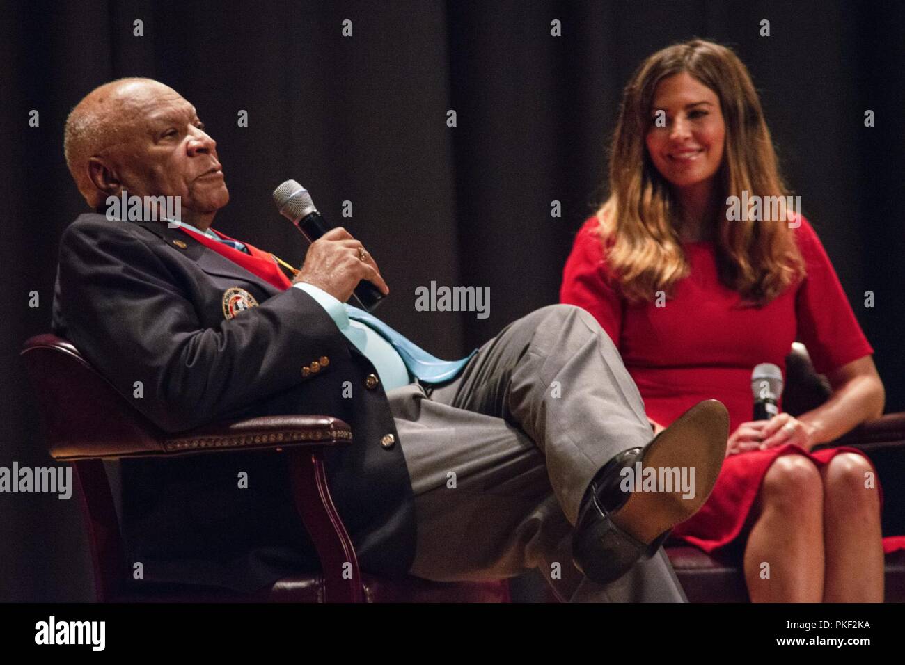 Retired U.S. Marine Corps Maj. James “Jim” Capers, Jr., speaks on stage ...