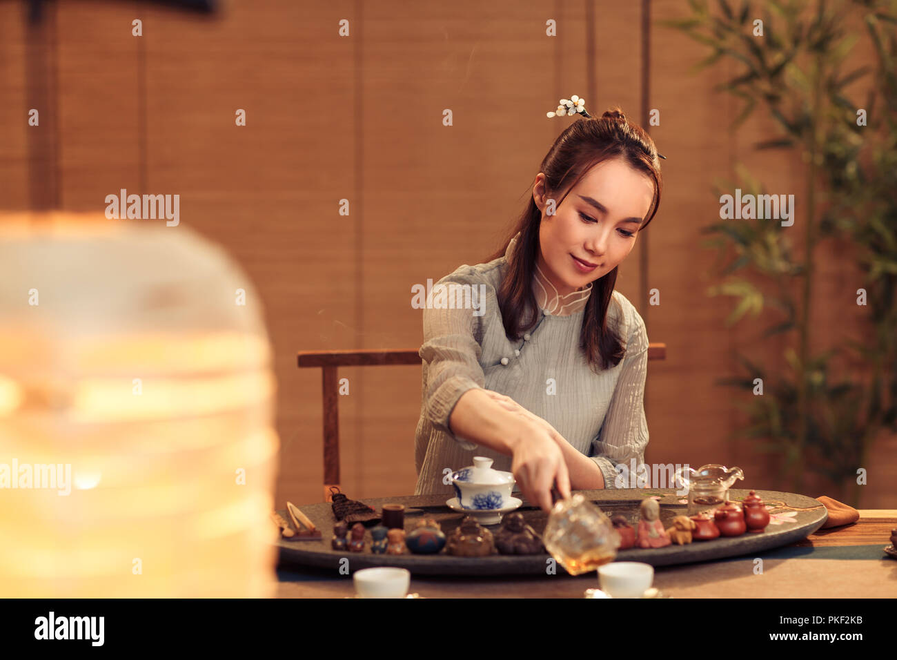 Young women show tea art Stock Photo - Alamy