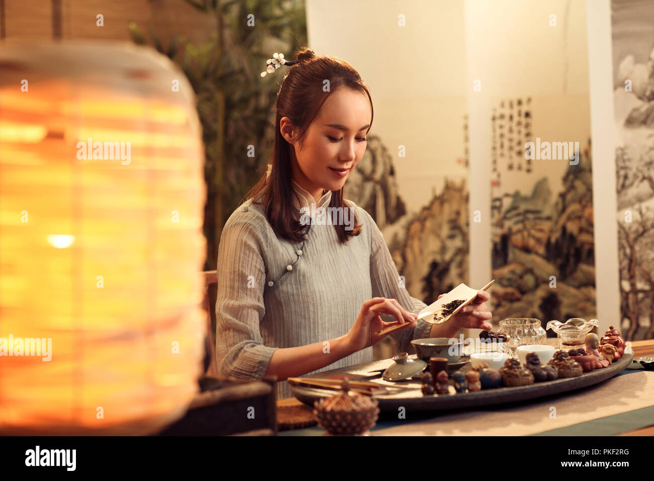 Young women show tea art Stock Photo - Alamy