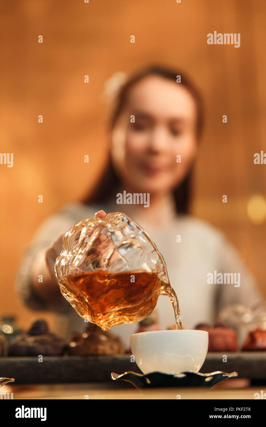Young women show tea art Stock Photo - Alamy