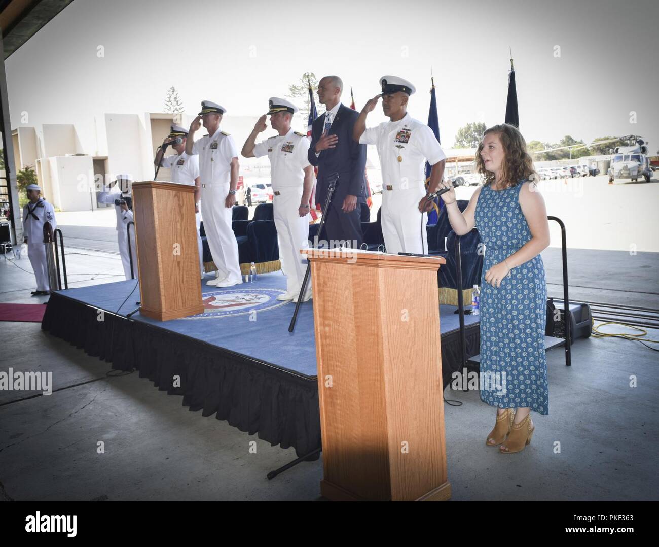 Gabriella Slentz sings the National Anthem during the official change ...