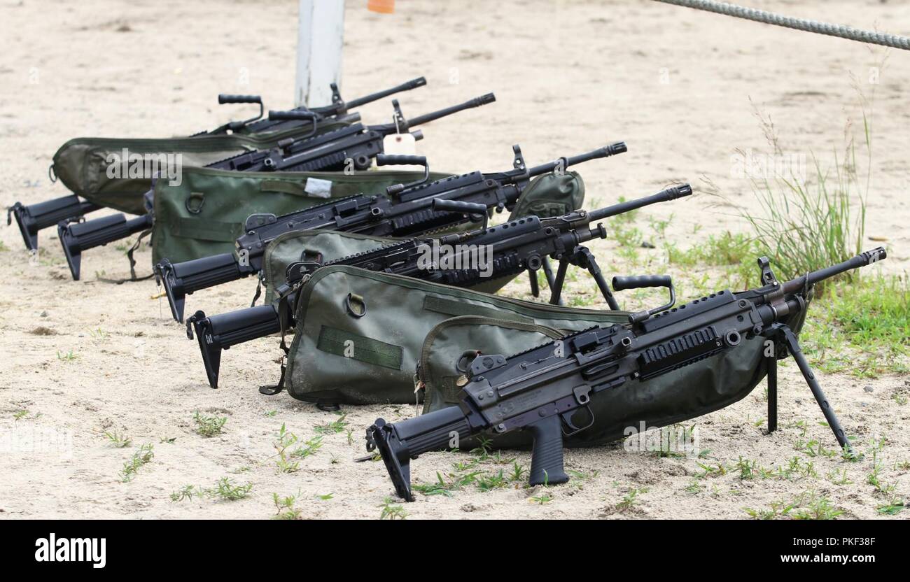 Several M249 light machine guns stand ready for qualification fire by U ...