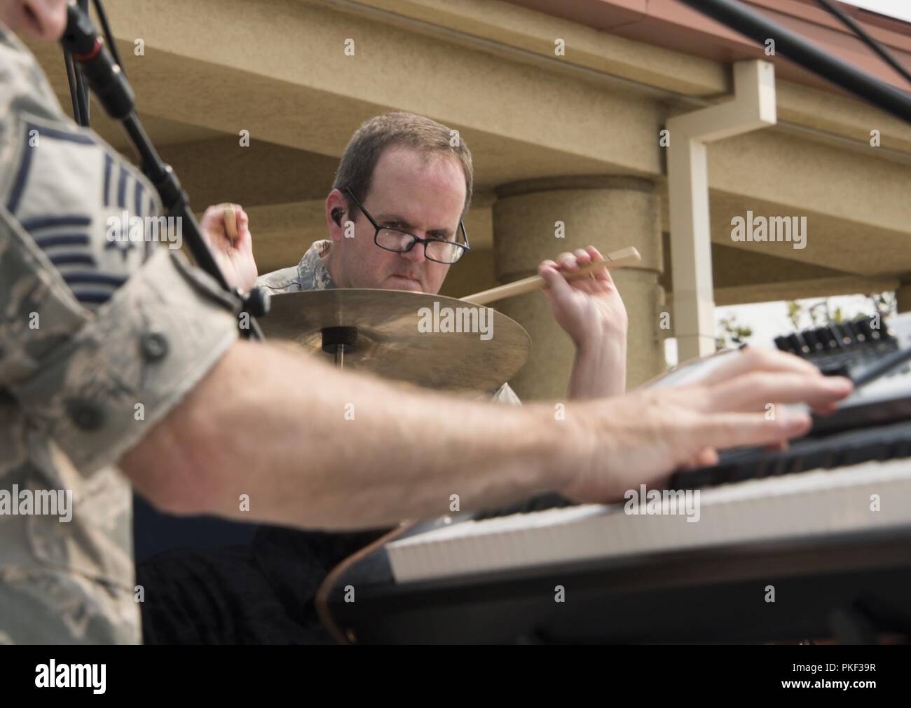 U.S. Air Force Airman 1st Class Casey Dodd plays percussion during the ...