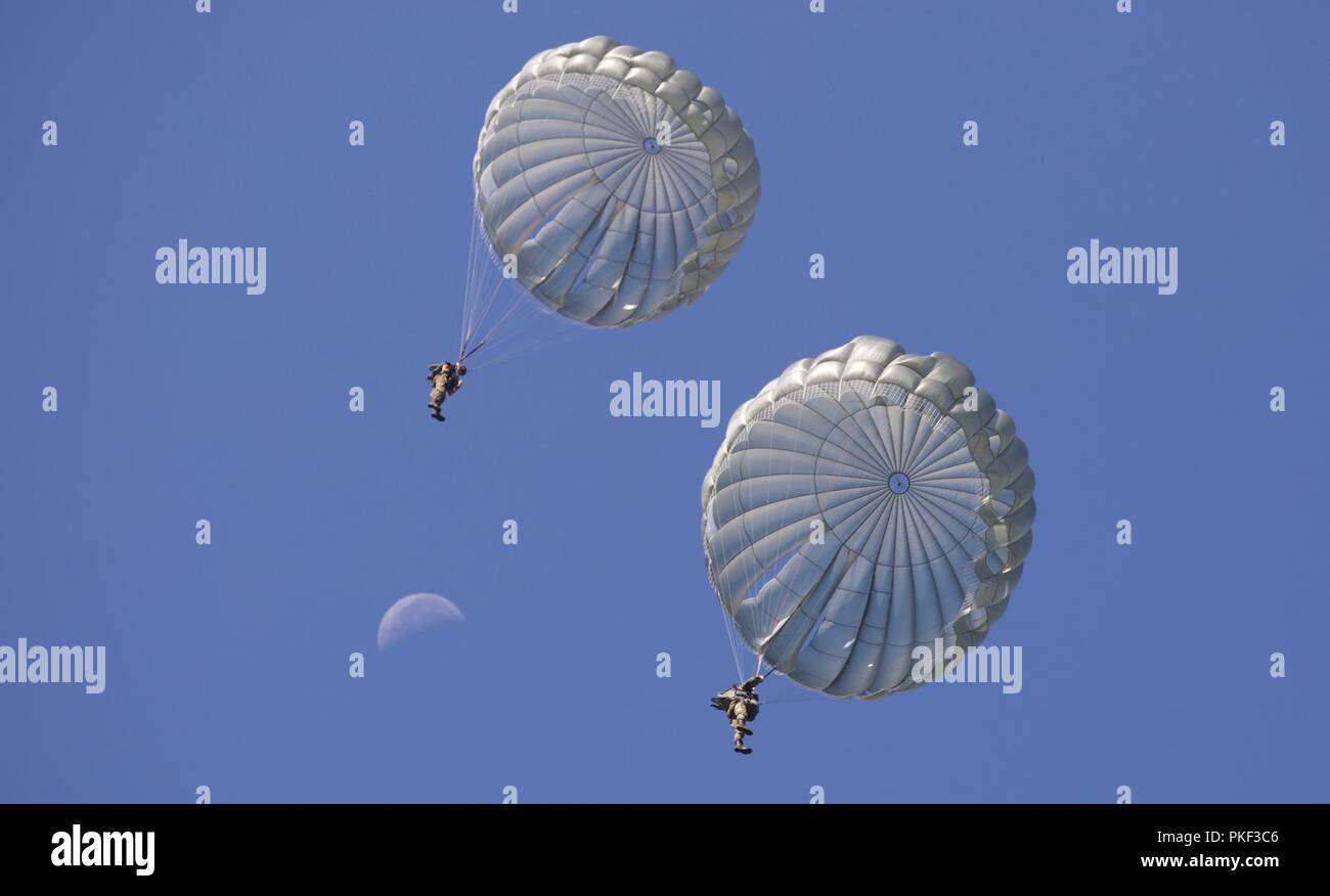 Two U.S. Army Paratroopers descend using their MC-6 parachute onto ...