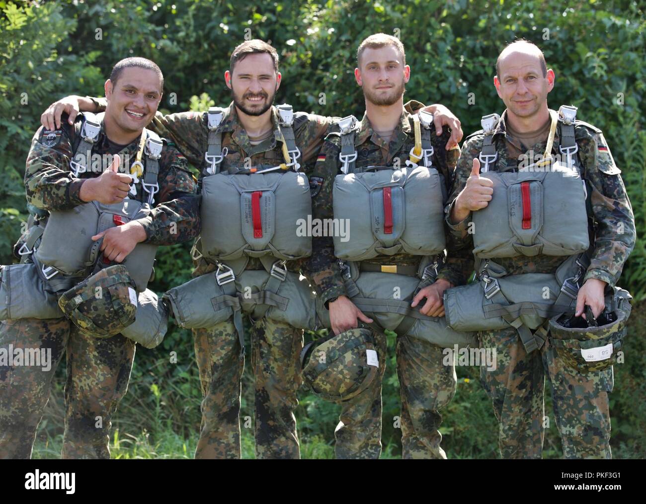 A group of German Paratroopers pose for a photo on the Pick Up Zone ...