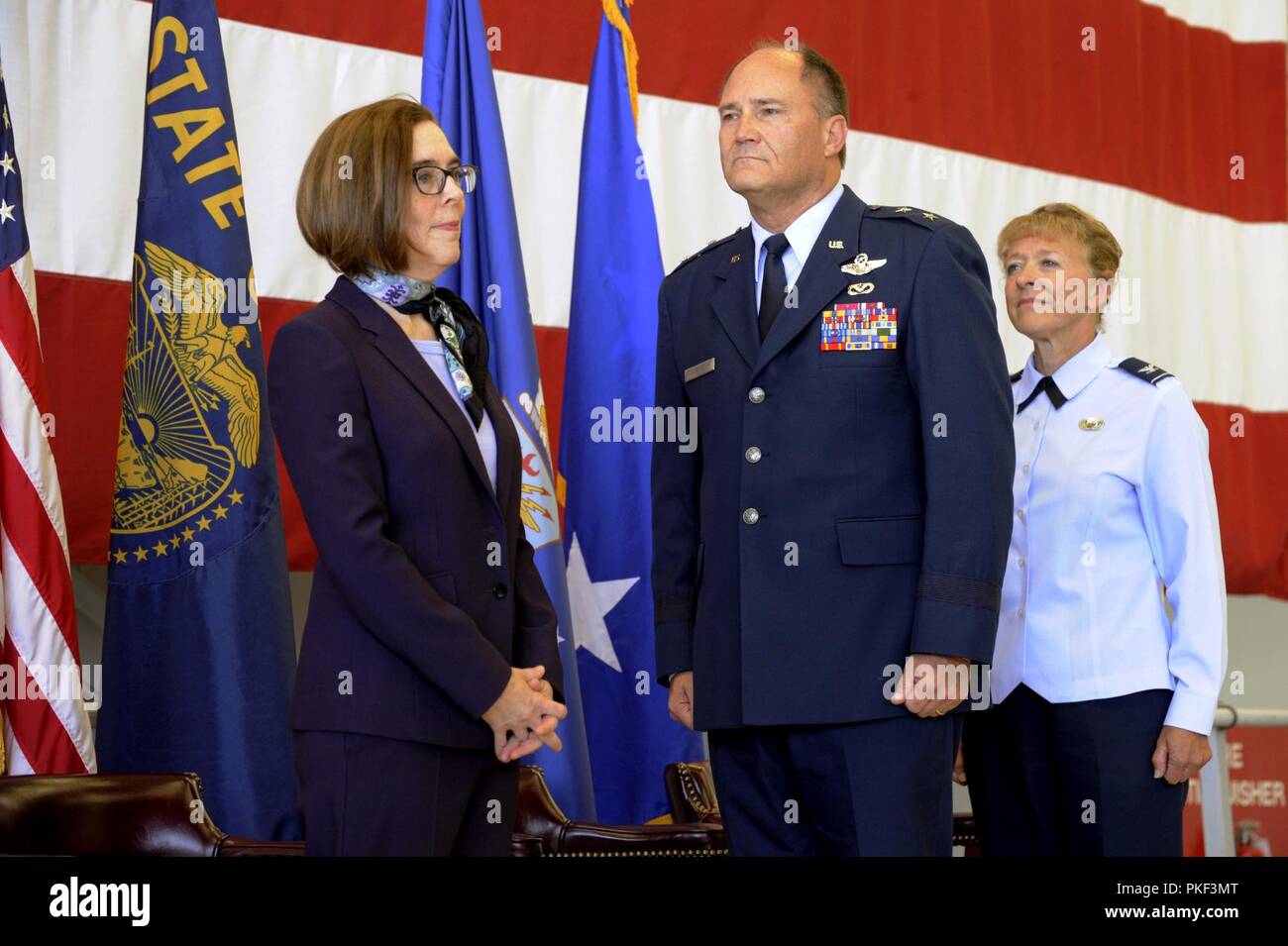 Oregon Governor Kate Brown (left) stands with Big. Gen. Michael Stencel ...