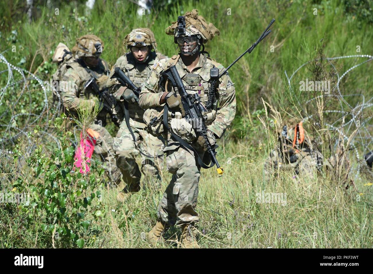U.S. Soldiers with 1st Platoon, A Company, 1st Battalion, 4th Infantry Regiment move through the ...