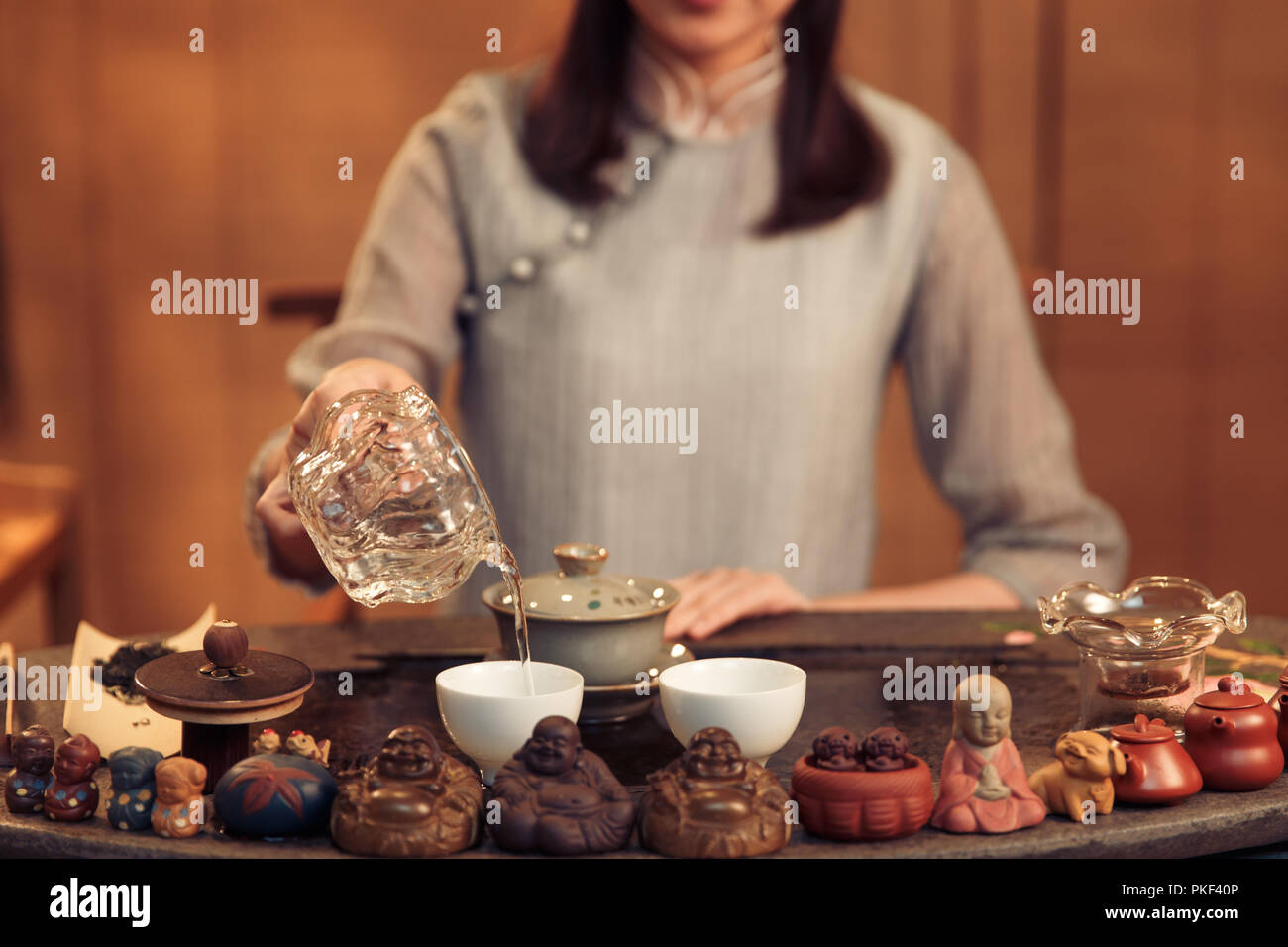 Young women show tea art Stock Photo - Alamy