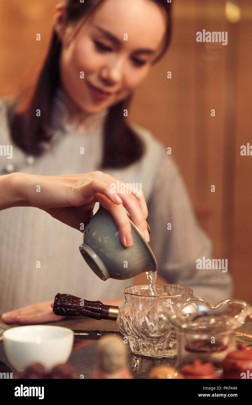 Young women show tea art Stock Photo - Alamy