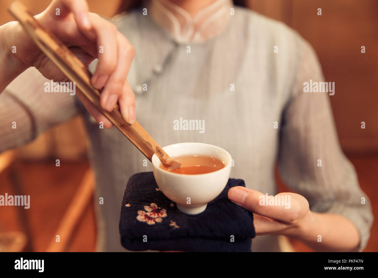 Young women show tea art Stock Photo - Alamy