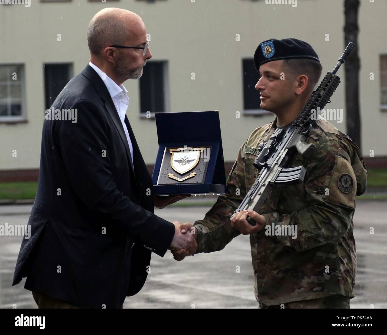 Mr. Jonathan Knott [left], Her Majesty’s Ambassador to Poland shakes ...