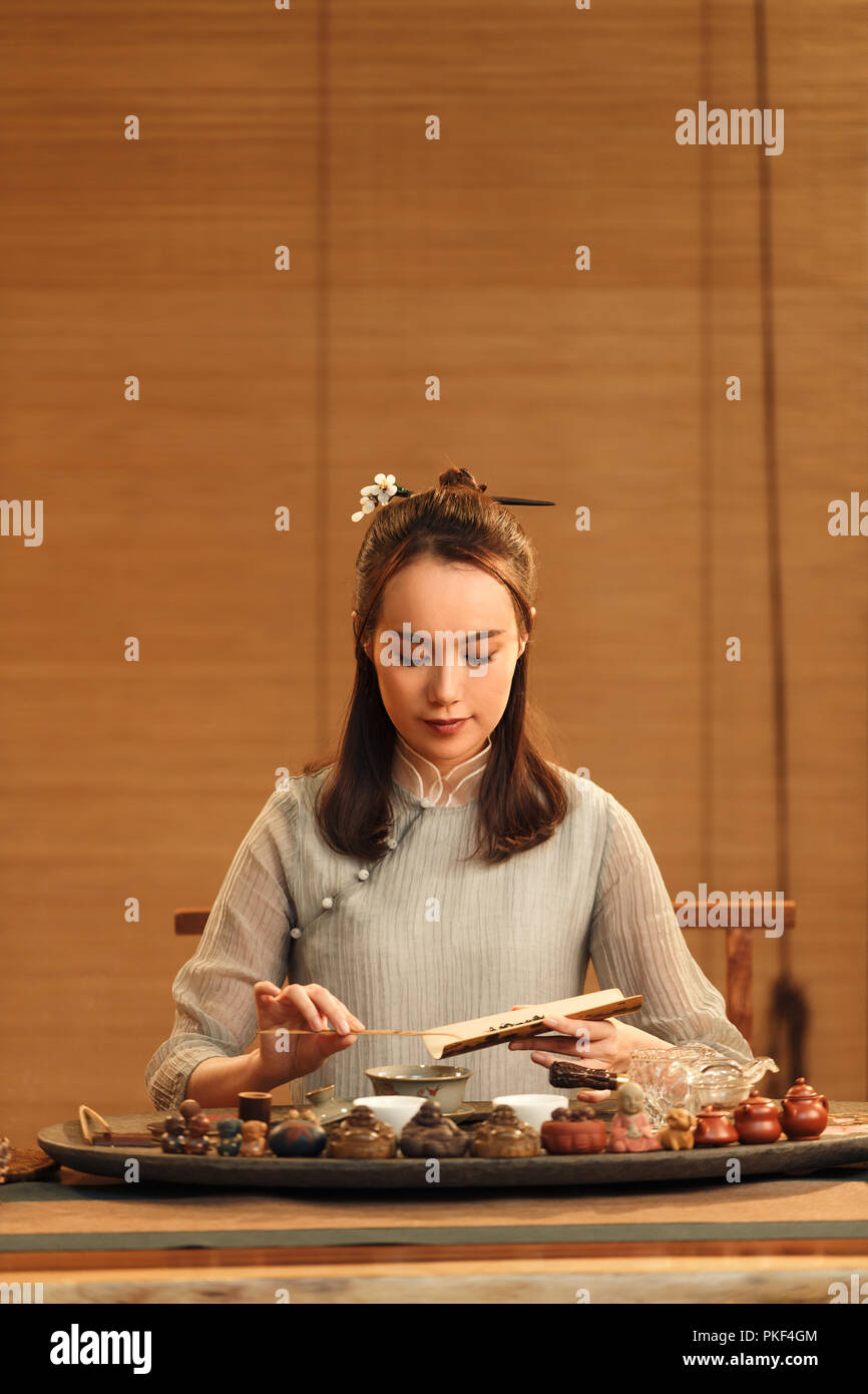 Young women show tea art Stock Photo - Alamy