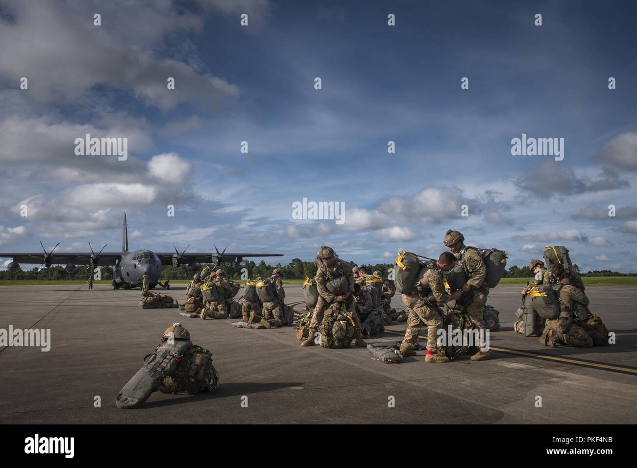 Airmen from the 820th Base Defense Group prepare for static-line jumps ...