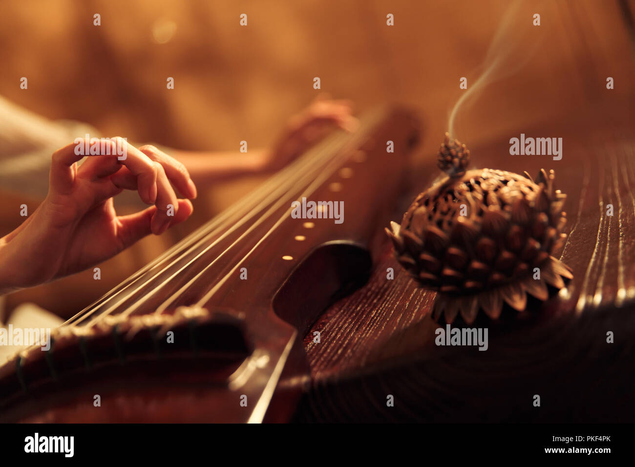 Young woman playing the lyre Stock Photo - Alamy