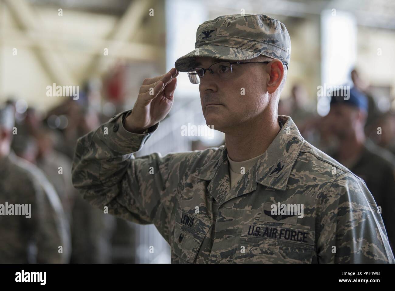 U.S. Air Force Col. Harmon Lewis, 3rd Wing vice commander, salutes ...