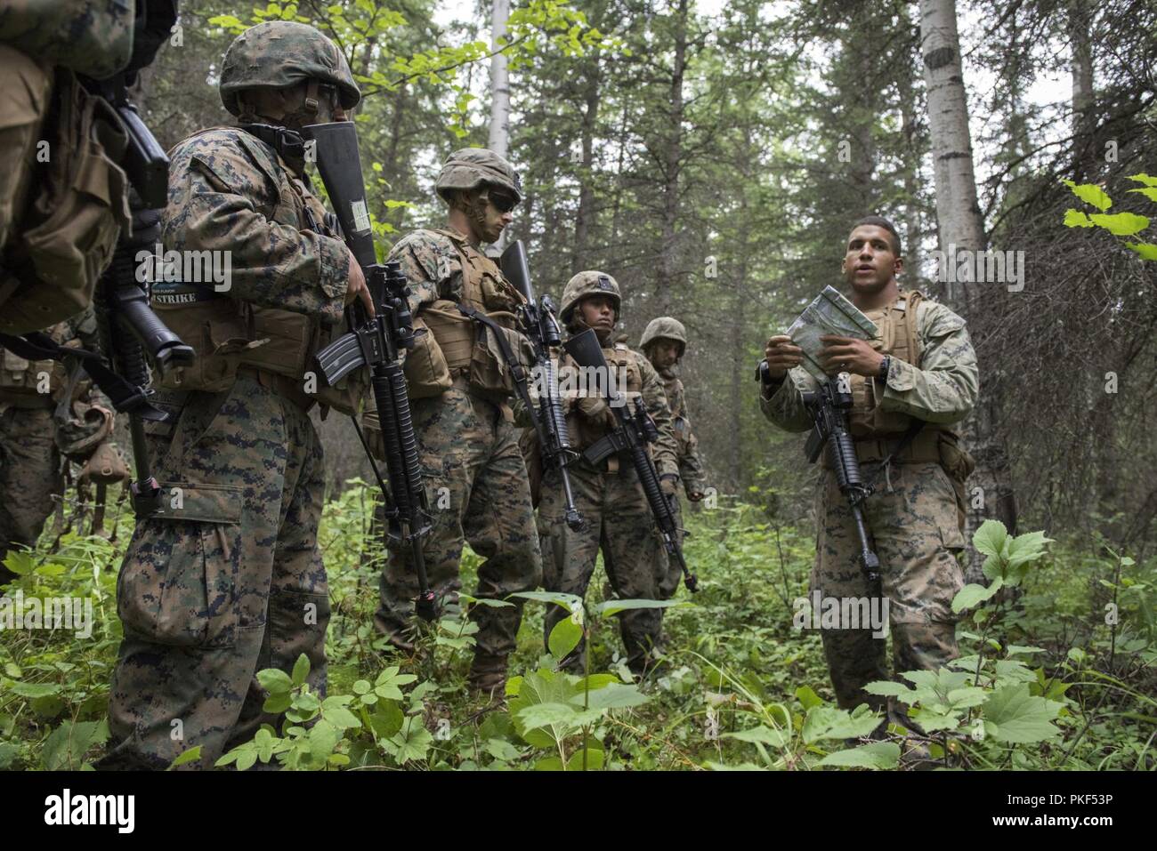 U.S. Marine Corps Sgt. James Ellis, right, the 3rd squad leader ...