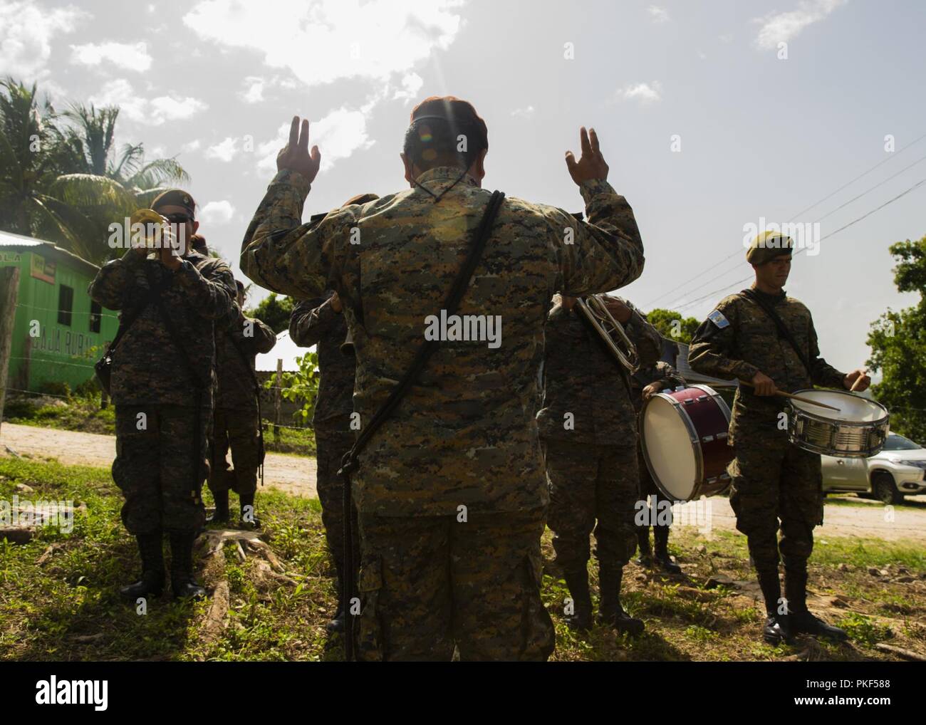 A Guatemalan Army band plays the U.S. national anthem before the ribbon ...